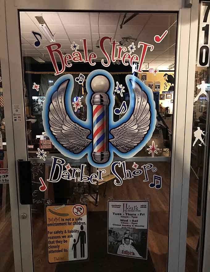 Those hand-painted wings and musical notes on the glass welcome you into something far beyond an ordinary barbershop.