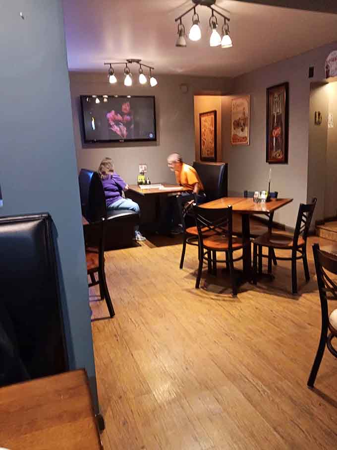 Wood floors and comfortable seating create that neighborhood spot vibe where everyone feels like a regular immediately.