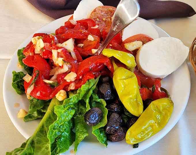 Fresh mozzarella with roasted peppers, tomatoes, and olives brings a taste of Italy to upstate New York.