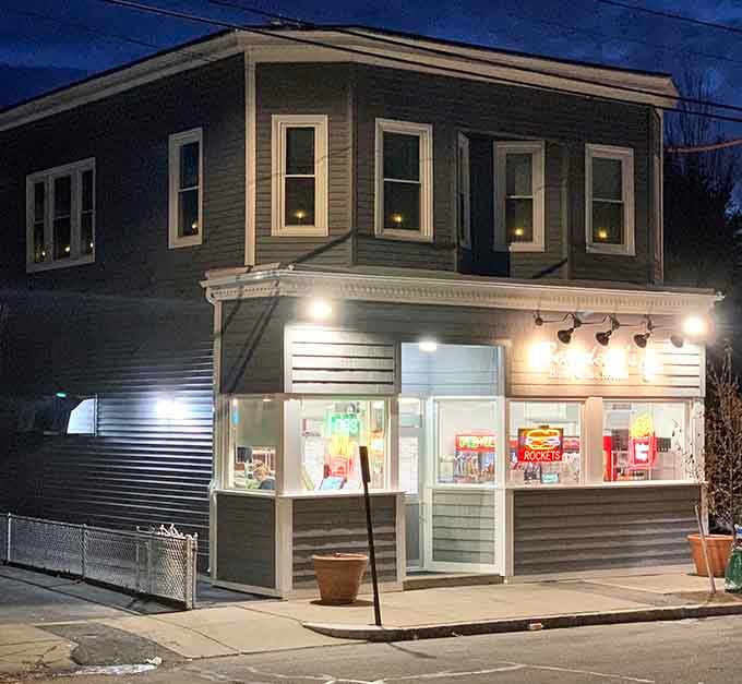 Evening lights illuminate this neighborhood gem where locals know the best meals come wrapped in butcher paper.