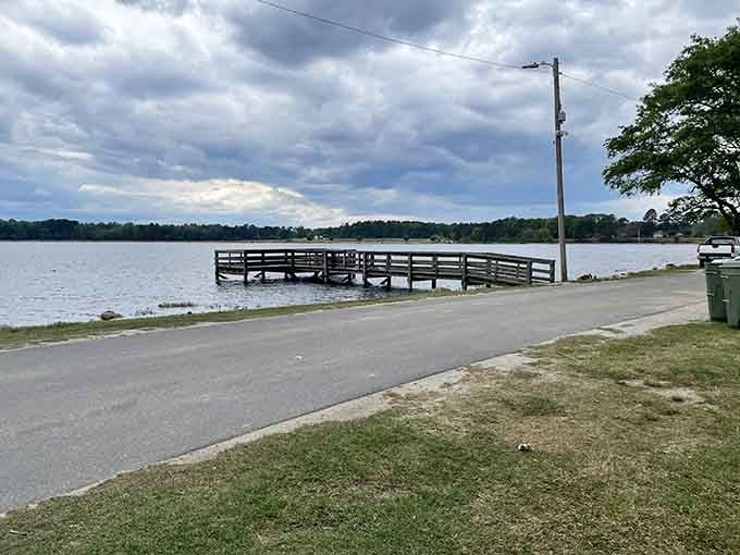 The fishing pier at Lake Wallace extends into calm waters where patience is rewarded, not rushed.