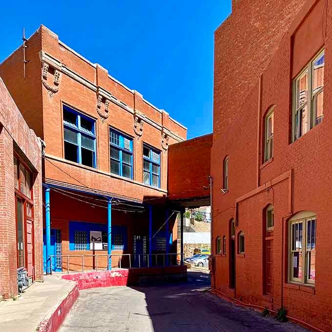 Narrow passages between brick buildings create intimate spaces where sunlight plays hide-and-seek throughout the changing day.