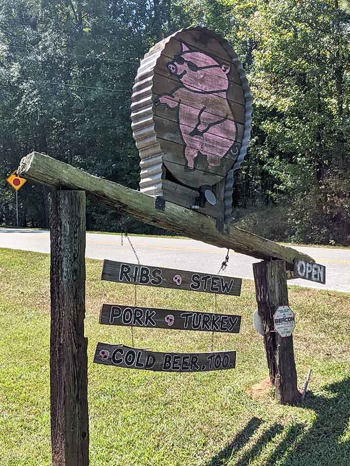The roadside sign advertises ribs, stew, pork, and turkey like it's announcing the lineup for a concert.