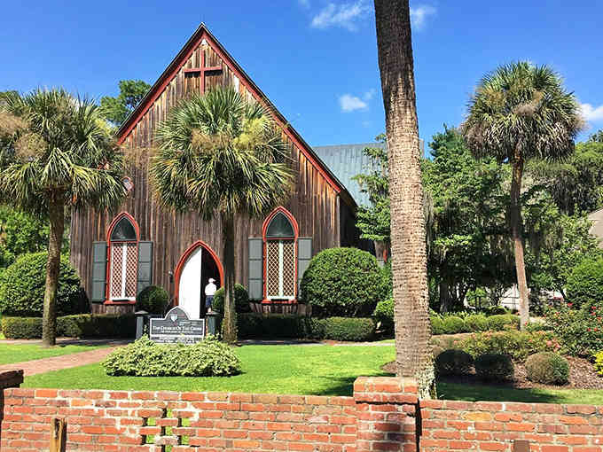 Gothic windows and palmetto palms create architectural harmony that proves Southern charm transcends any single era or style.