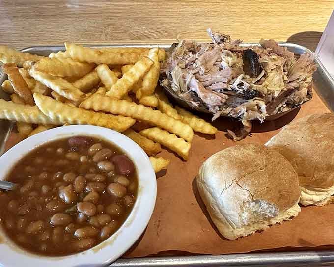 Pulled pork piled high with beans and crinkle fries &ndash; comfort food that doesn't apologize for being exactly what it is.