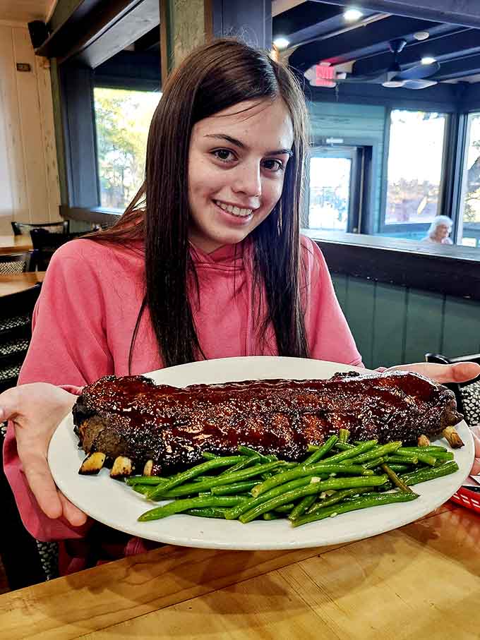 That smile says everything you need to know about the full rack of ribs experience here.