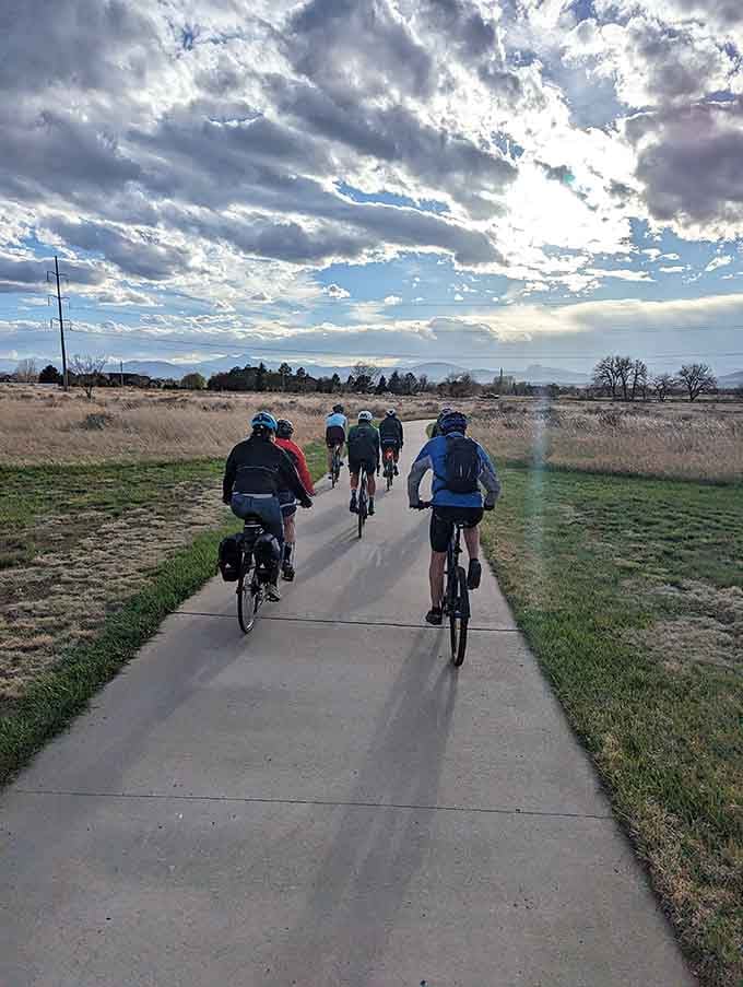 Cyclists roll along the trail in formation, enjoying that rare flat Colorado path that doesn't punish knees.