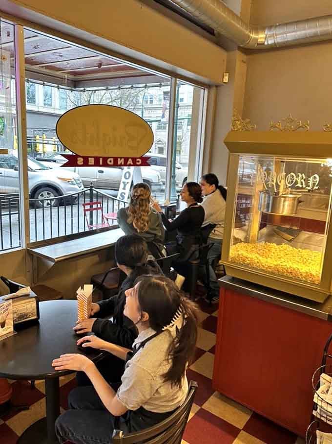 Window seats for watching Main Street while contemplating your next sugar-fueled purchase, because multitasking is important here.