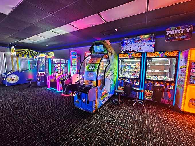 Purple and pink lighting bathes the arcade in a glow that makes everything feel like a celebration, even Tuesday afternoons.