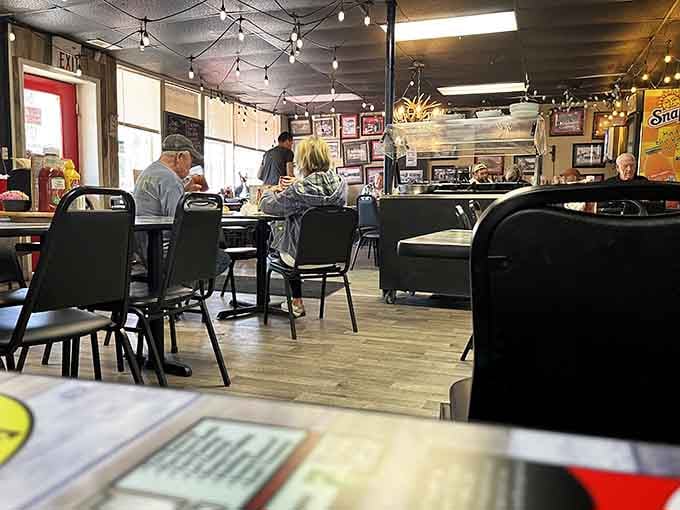 Inside, locals gather at simple tables where conversation flows as freely as the sweet tea and coffee.