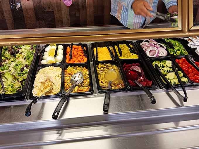 A salad bar stocked with fresh vegetables proves this place takes every meal component seriously, even the healthy ones.