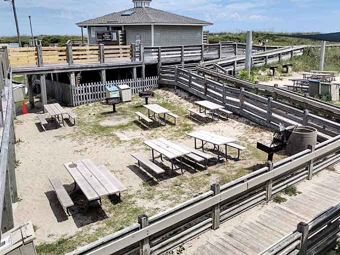 Picnic tables scattered across sandy grounds invite casual gatherings where burgers taste better and laughter comes easier than anywhere else.