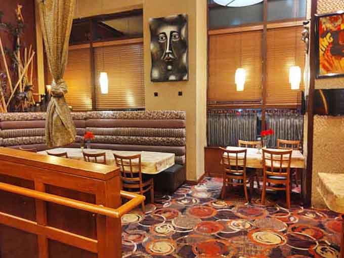 Tables set and ready for the kind of meal that turns strangers into friends and friends into family.