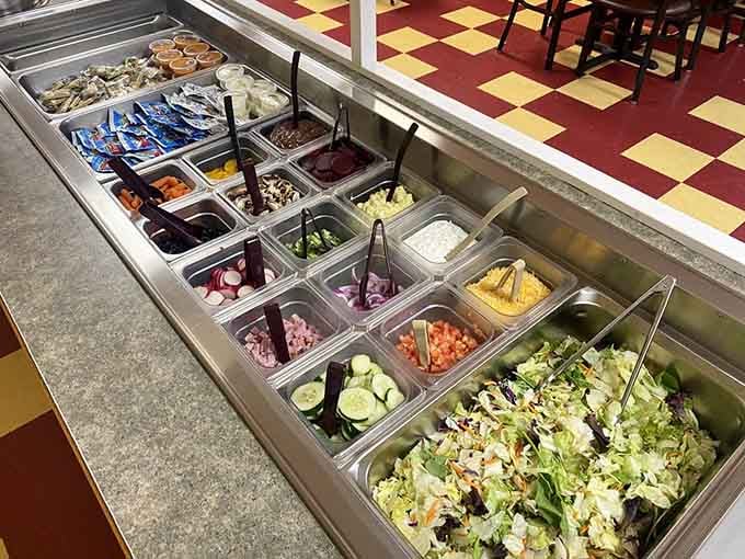 A salad bar stocked with fresh ingredients means you can customize your meal exactly how you want it, though let's be honest, you're here for the fried chicken.