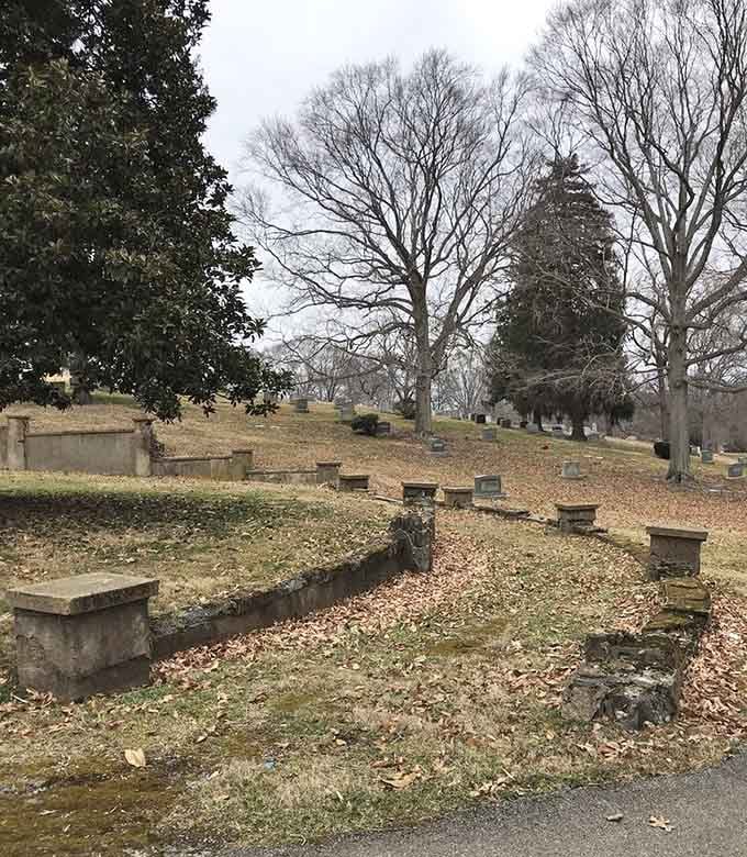 Mature oak trees provide a living canopy over these grounds, standing guard like nature's own cathedral columns.