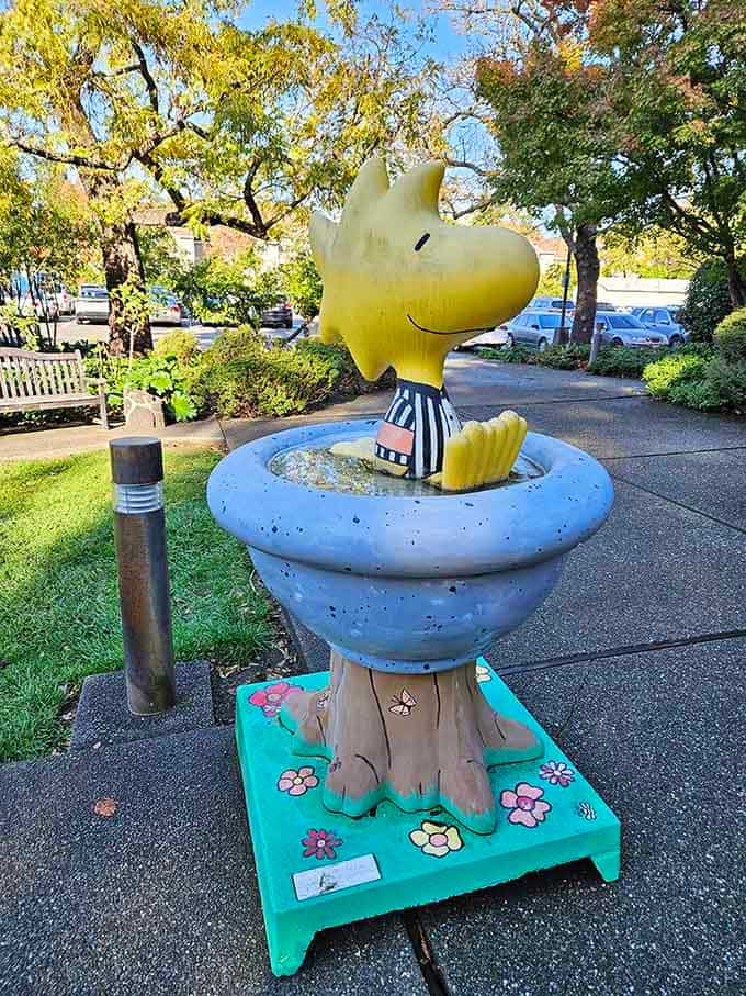 Woodstock perches outside, a cheerful yellow beacon reminding passersby that whimsy lives here year-round always.