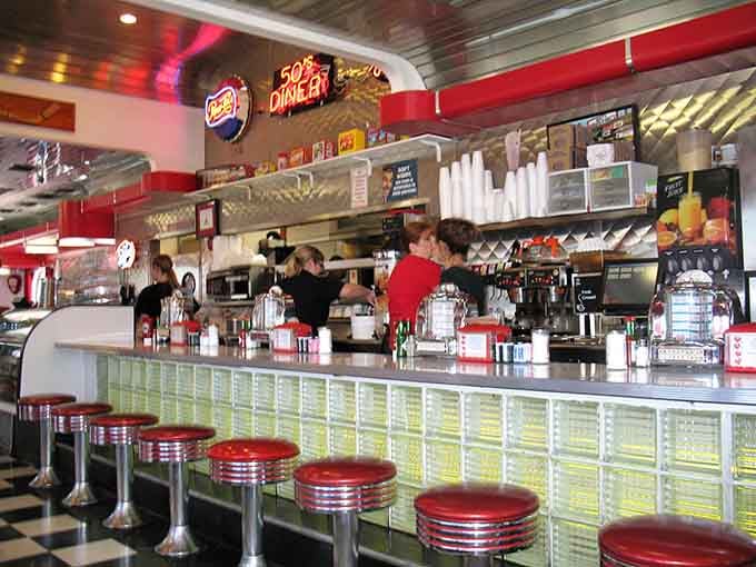 Behind that gleaming counter, the staff works with the practiced efficiency of people who truly know their craft.