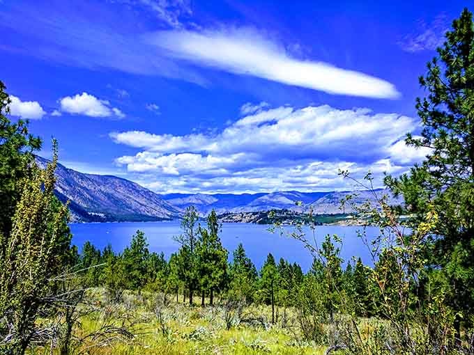 Lake Chelan stretches endlessly beneath endless blue skies, proving Washington has more than one weather setting.