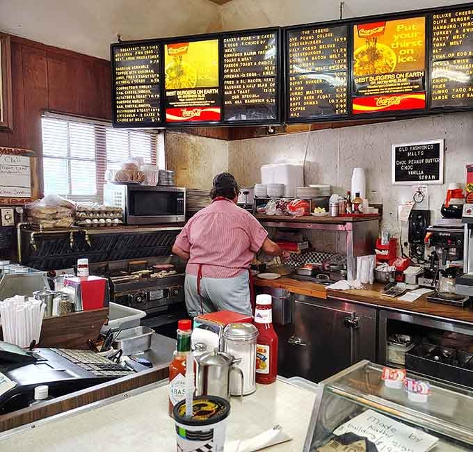 Watch your burger sizzle on the grill where skilled hands turn simple ingredients into something truly magnificent.