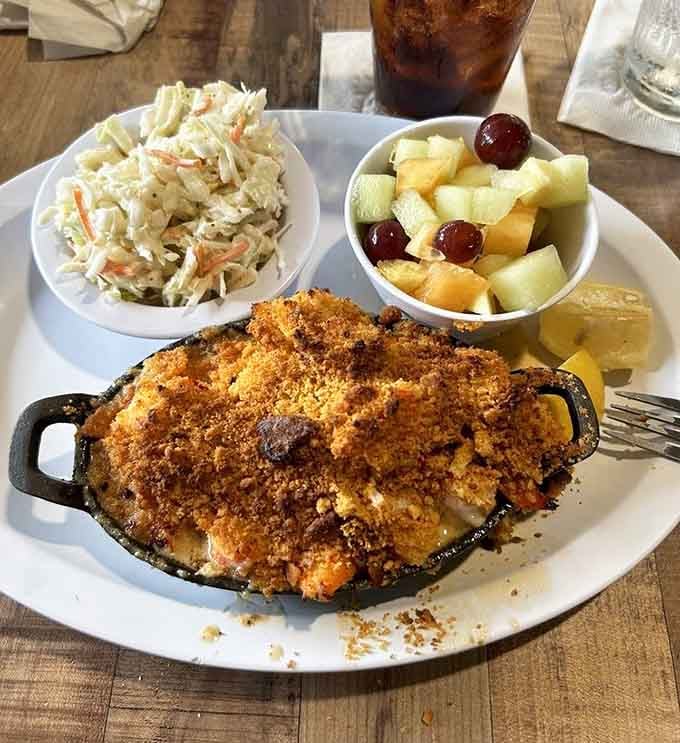 That golden-topped lobster pie in its little skillet looks like someone baked all of New England's greatest hits into one dish.
