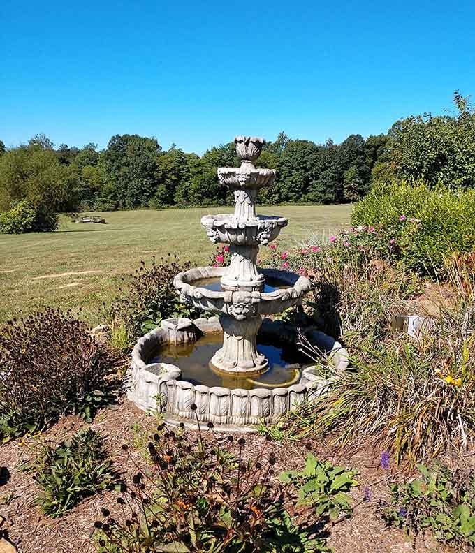 That tiered fountain surrounded by gardens adds European estate charm to the Indiana countryside landscape.