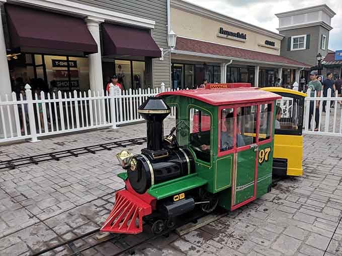 A miniature train adds whimsy to the shopping experience, delighting kids while parents calculate their growing purchase totals.
