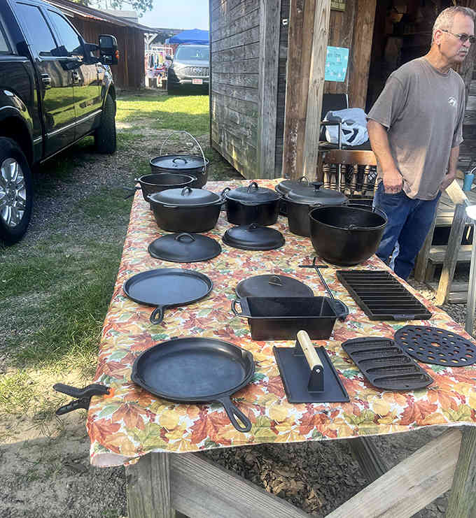 Cast iron cookware displayed like Southern heirlooms, the kind of skillets that get passed down through generations of family.