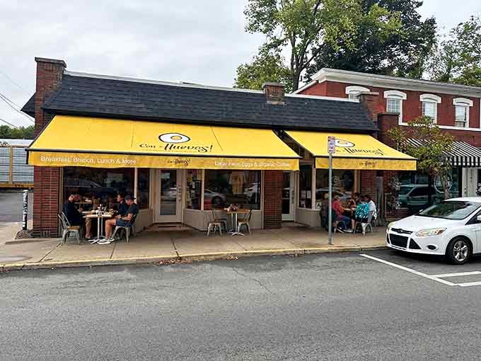 The brick building with twin yellow awnings looks like it's been serving happiness for generations.