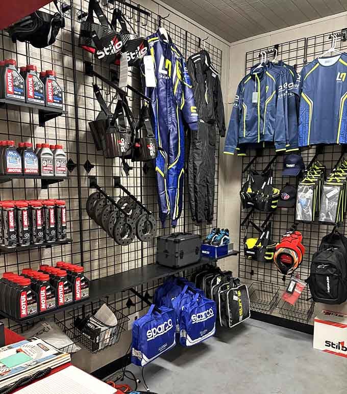 Racing suits and gear line the walls like a motorsport boutique for the aspiring champion in you.