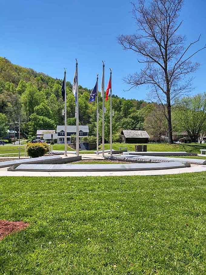 Five flags stand at attention, honoring the trails that converge here and the adventurers who walk them faithfully.