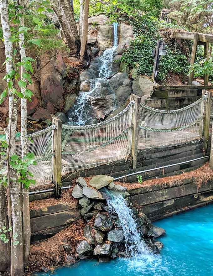 This waterfall adds a touch of natural beauty to the manufactured nostalgia, and we're absolutely here for it.