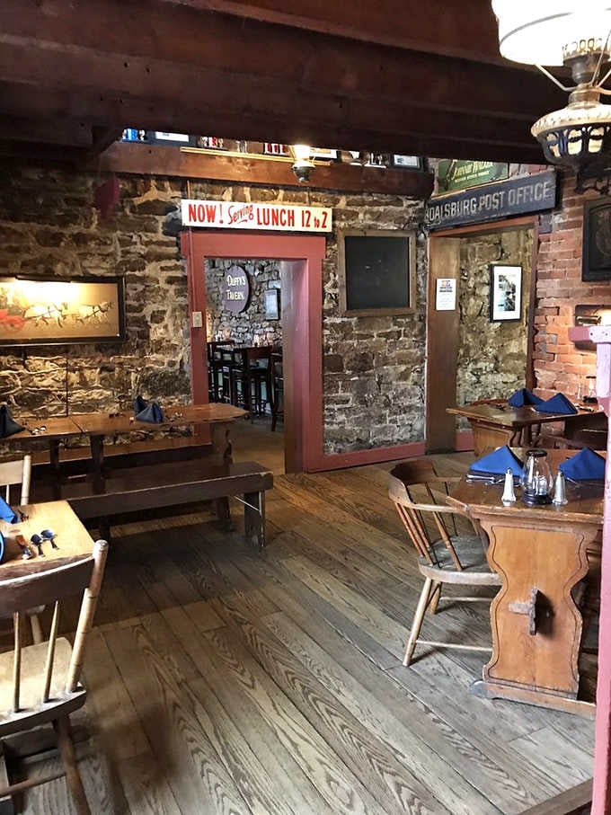 Vintage signage and exposed stone walls transport diners back in time while keeping them comfortable in the present moment.