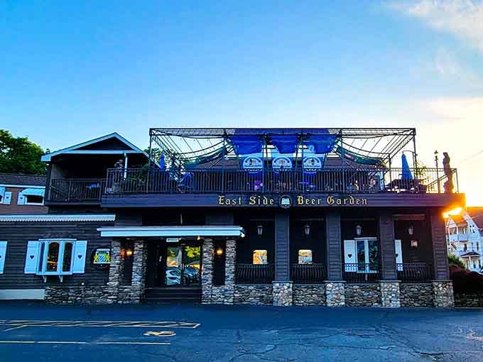 The exterior at dusk with the beer garden sign glowing, beckoning hungry travelers to their Bavarian destiny.