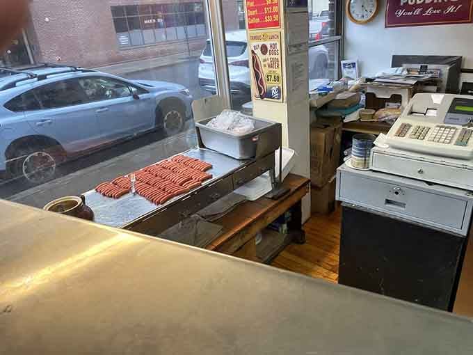 Rows of mini hot dogs waiting on the griddle represent pure potential, moments away from becoming someone's delicious obsession.