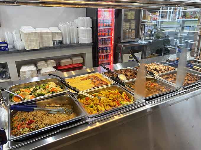 The hot food display showcasing an impressive array of options that go well beyond your typical barbecue joint offerings.