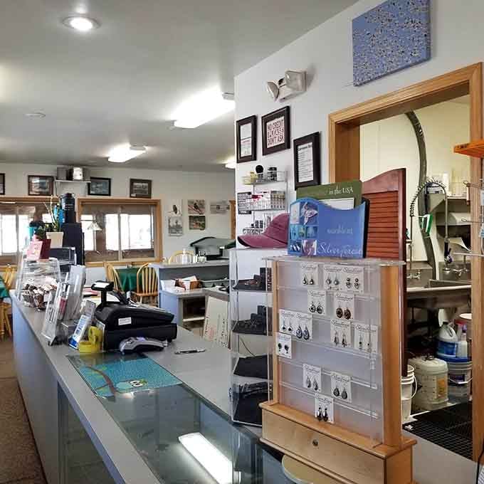 The counter displays local crafts and essentials, proving this store serves the whole community beautifully.