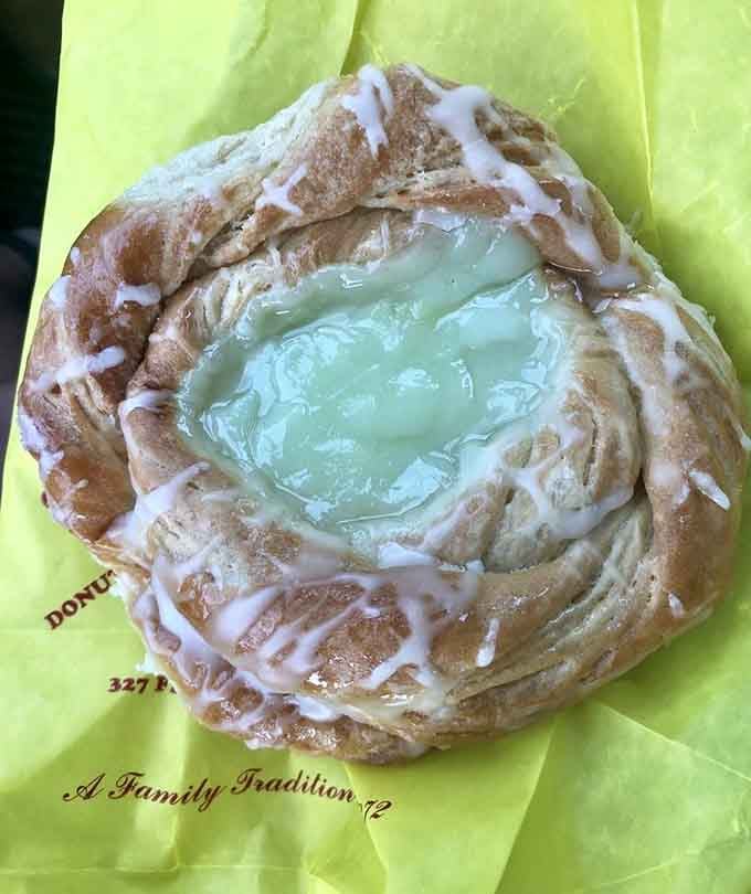 Key lime filling pools in flaky danish layers, creating a tropical vacation for your taste buds.