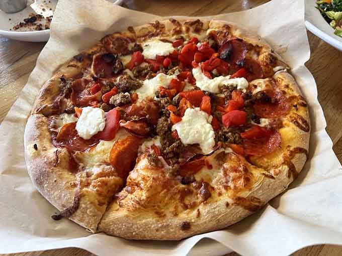 Pizza fresh from the oven with generous toppings, because carbs are essential when you're potentially communing with the other side.