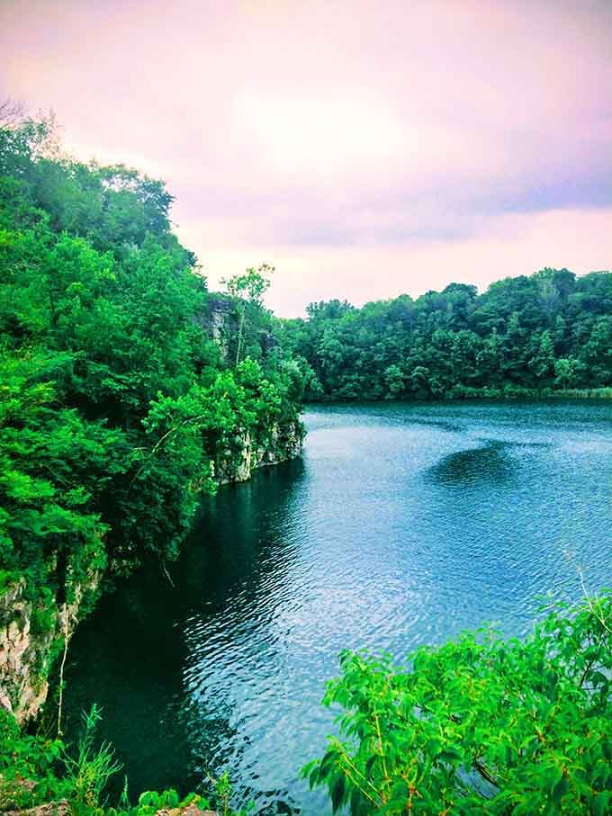 Limestone cliffs embracing emerald waters in a geological hug that's been millions of years in the making.