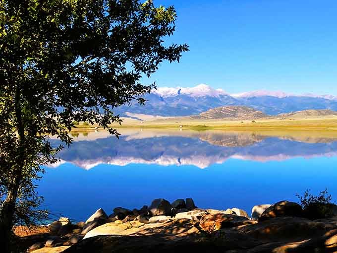 Lake reflections so perfect, they'll make you question which way is up and wonder why mirrors exist.