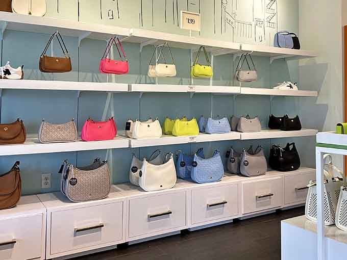 Kate Spade purses lined up like colorful soldiers, ready to march into your closet at surprisingly reasonable prices.
