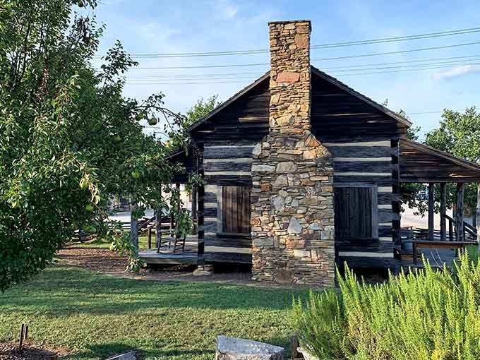 Hand-hewn logs and stone chimney transport you to frontier days when pioneers built homes with determination and available materials.