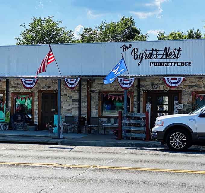 The Byrd's Nest Marketplace flies the flags proudly, proving patriotism and antiques go together like biscuits and gravy.