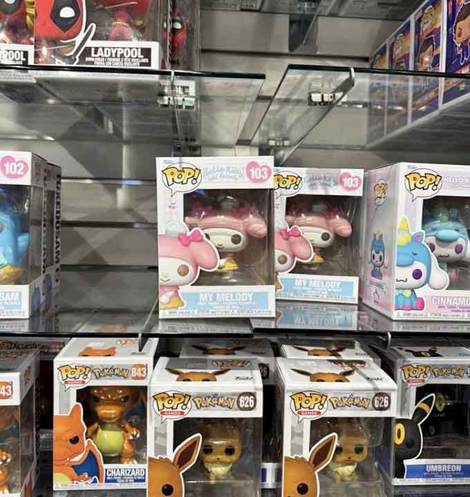 Funko Pops stacked like a vinyl collection, each bobblehead a tiny monument to characters we've loved for years.