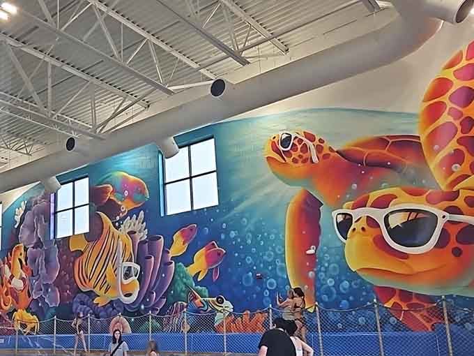 Vibrant underwater murals featuring cheerful sea creatures add personality to the walls and Instagram-worthy backdrops for family photos.