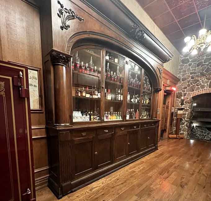 An antique wine rack that's equal parts functional bar storage and museum-worthy Western artifact display.
