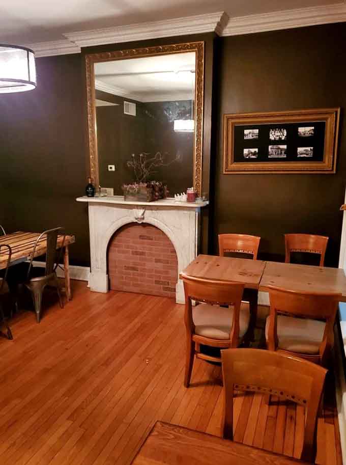 That arched brick fireplace and vintage mirror create an atmosphere reminiscent of dining in your coolest friend's historic home.