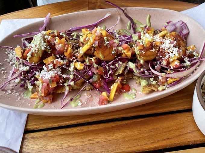 Shrimp tacos piled with purple cabbage and crumbled cheese, turning Taco Tuesday into any-day-that-ends-in-Y Tuesday.