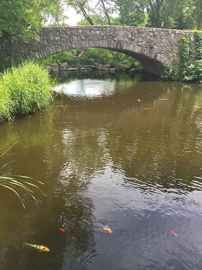 This peaceful pond with its stone bridge looks like a postcard from a much fancier vacation.