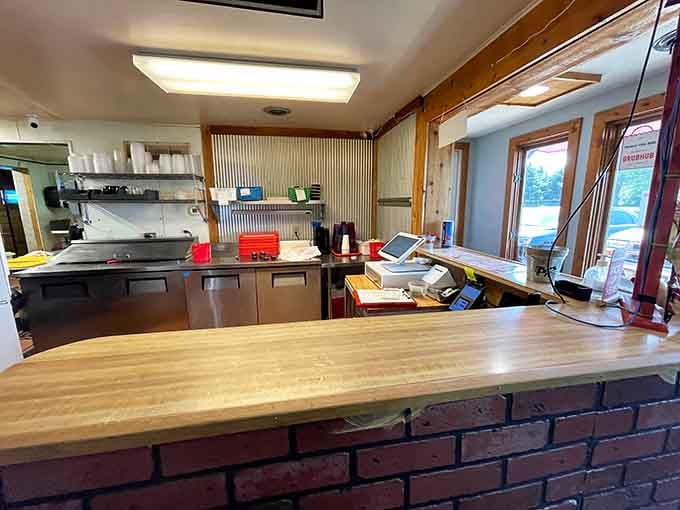 The order counter where dreams are spoken aloud and transformed into plates of smoky perfection.